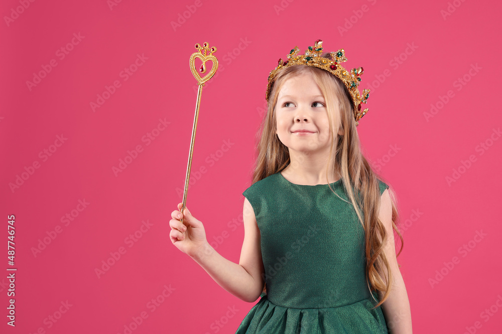 Cute girl in fairy dress and golden crown holding magic wand on pink ...