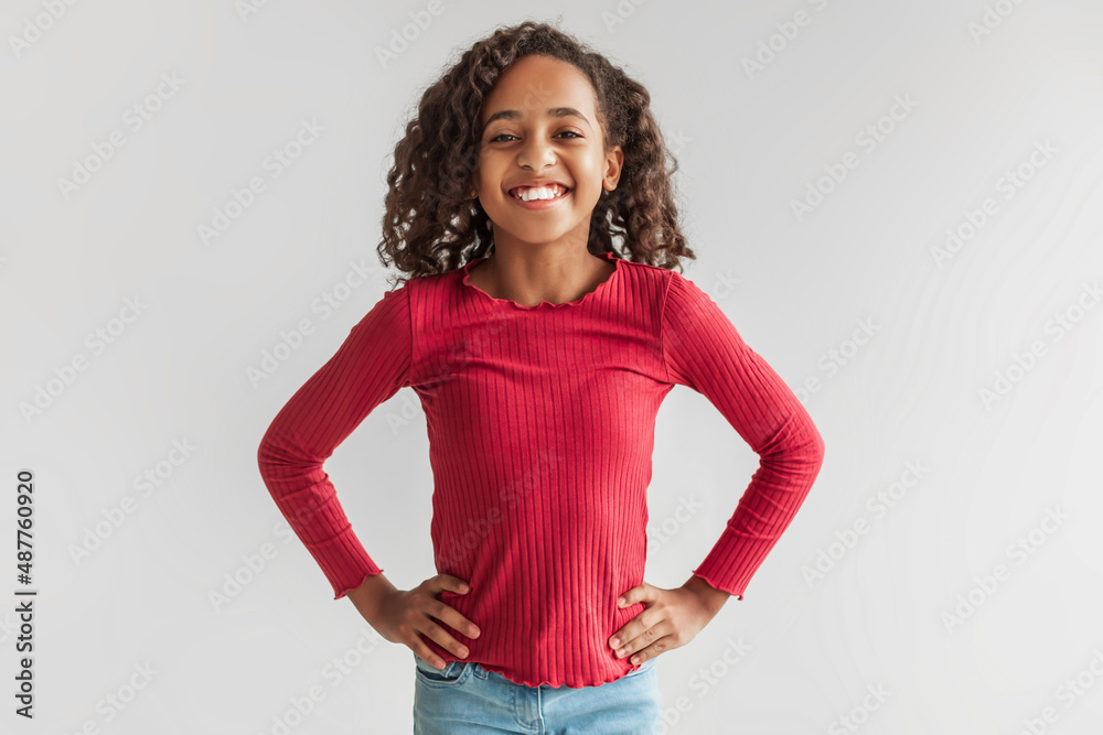 Positive African Girl Standing Holding Hands On Hips, Gray Background ...