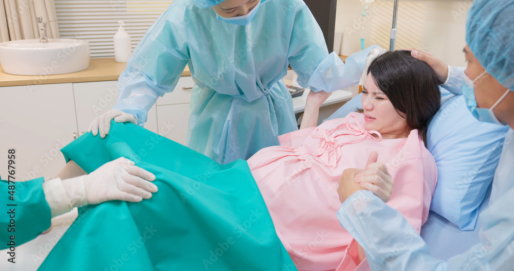 pregnant woman in delivery room Stock Photo | Adobe Stock