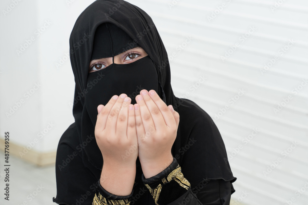 Little Asian Pakistani Muslim girl wearing black hijab with beautiful ...