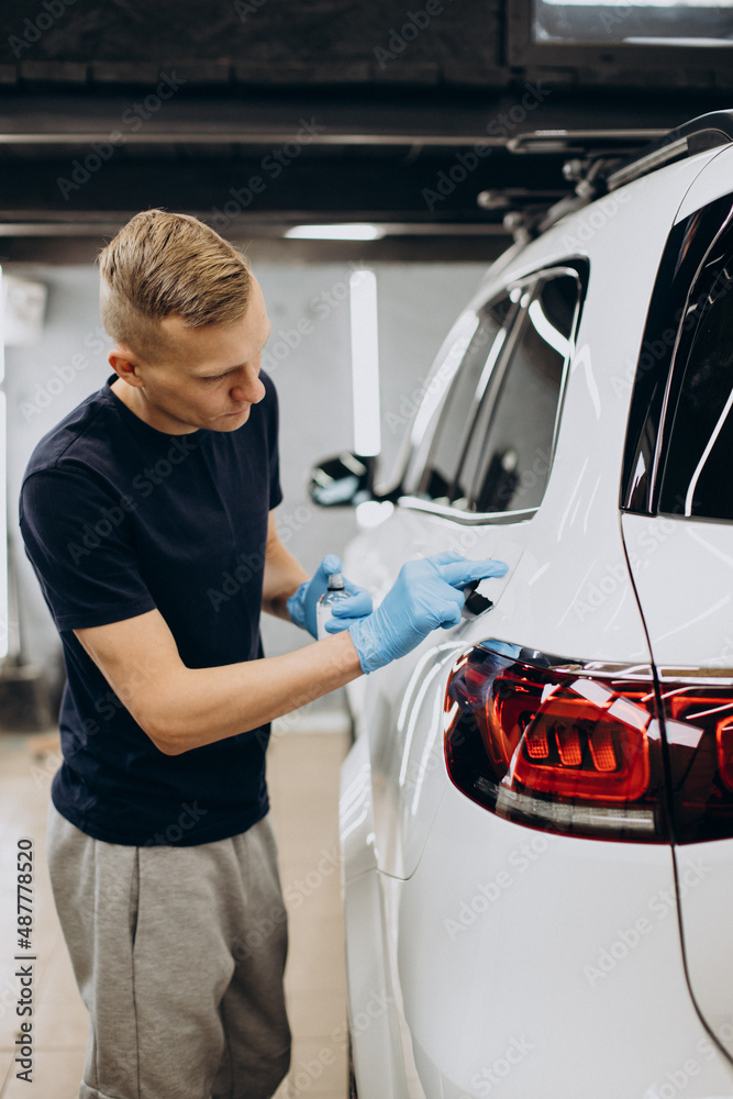 Man working car detailing and coating car Stock Photo | Adobe Stock