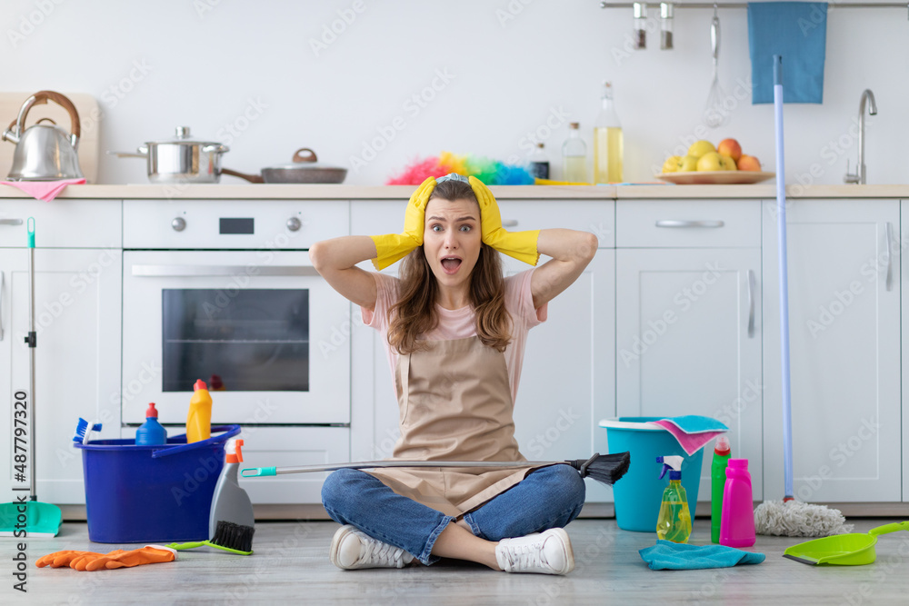 Full length portrait of terrified young woman holding her head and ...