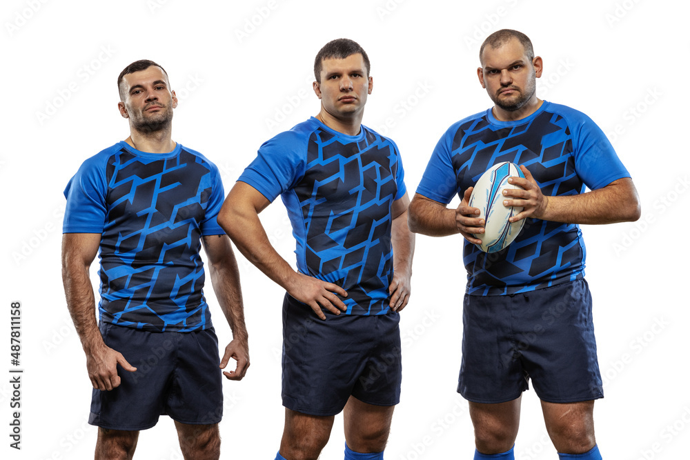 Group portrait of strong athletes, rugby players standing together like ...