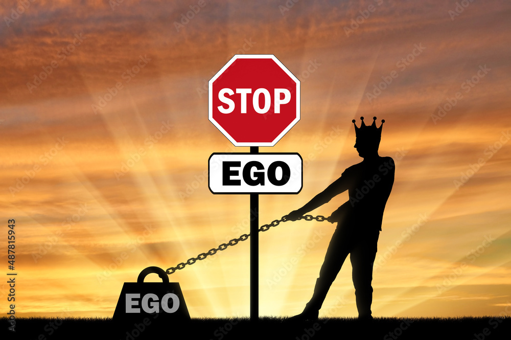 The silhouette of a selfish man with a crown on his head draws a heavy ...