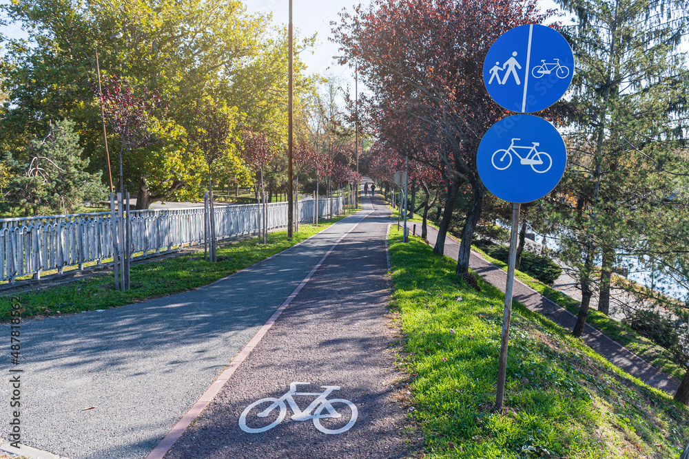 bike lane and pedestrian signs in an outdoor park Stock Photo | Adobe Stock