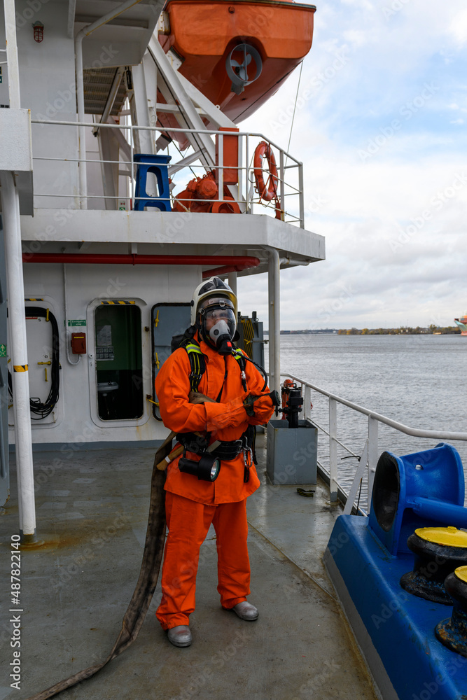 Fireman. Fire fighting equipment. Fire drill. Seaman with fire-fighter ...