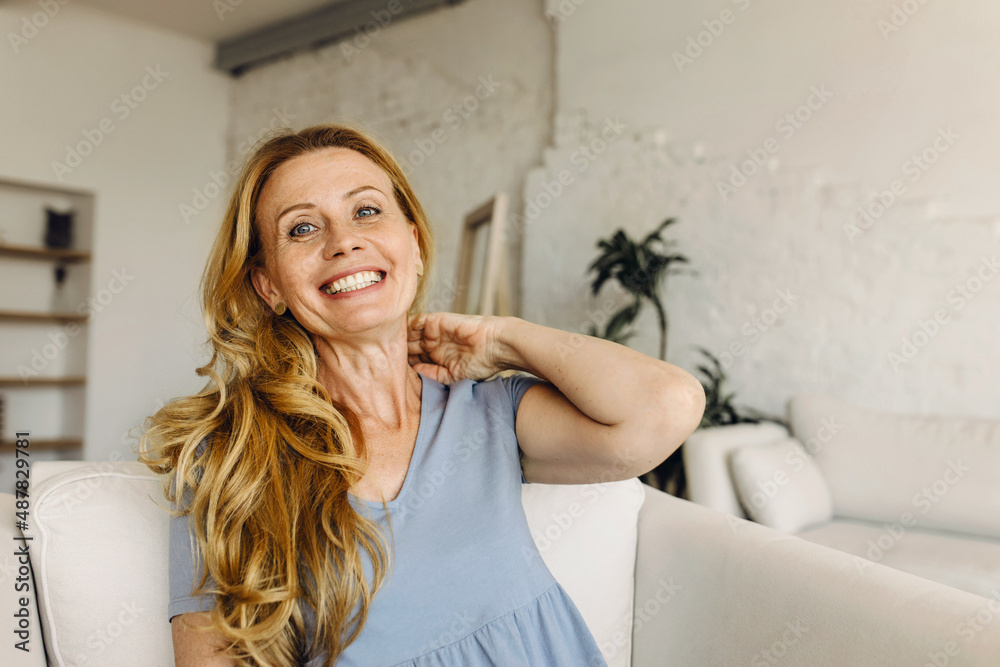 Horizontal portrait of cheerful good-looking European lady with perfect ...