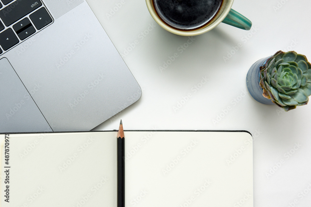 Office desk setup for home working with online computer a note book and ...