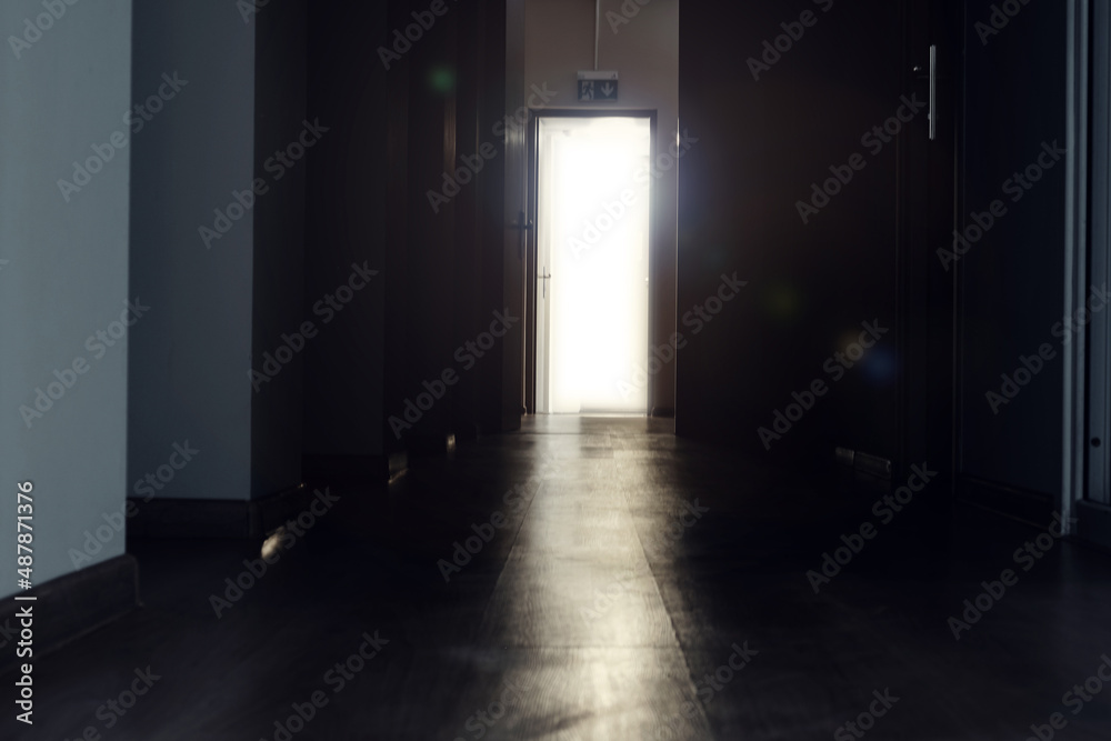 Bright light coming out of the door in the end of a dark hallway Stock ...