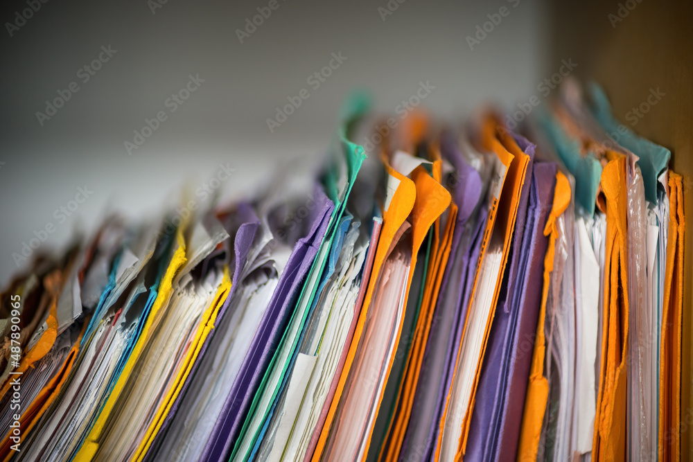 Paper files in folders, old documents for storage and archiving by ...