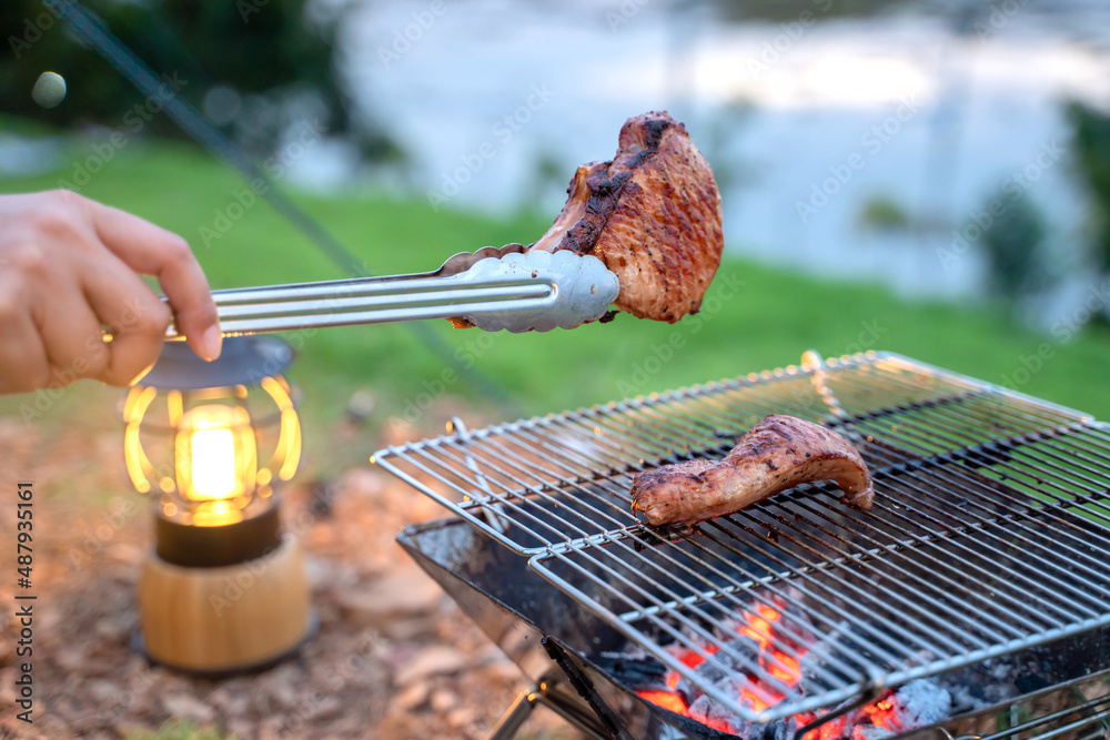 Cooking food during camping at natural park in Thailand. Recreation and ...