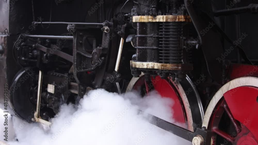 Old wheels and parts of a steam engine close-up. Soviet locomotive ...