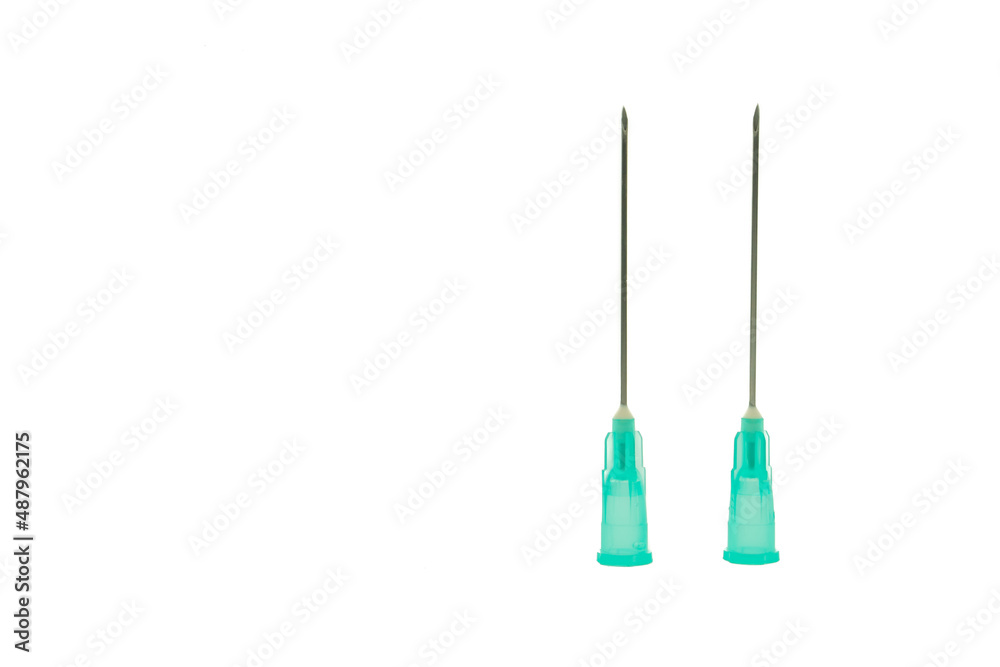 Horizontal photo with a pure white background of two medical syringe ...