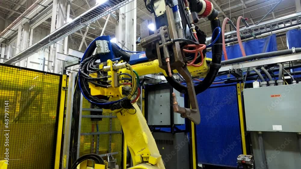 Fanuc robot, manufacturing automation with a spot weld gun - Shot in 4K ...