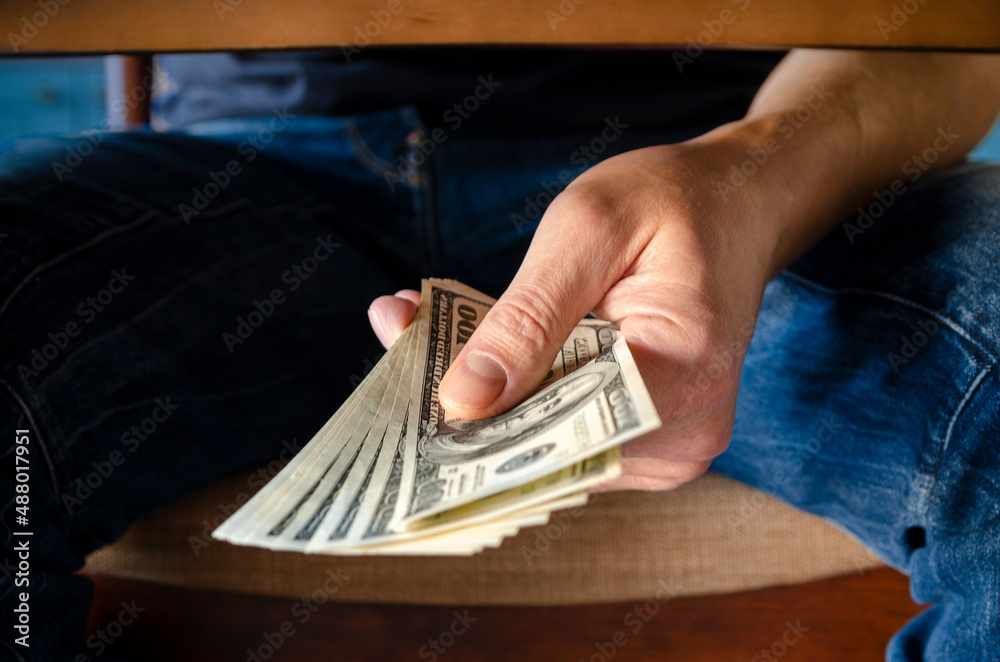 Hands passing money under table corruption bribery Stock Photo | Adobe ...