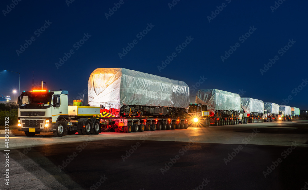 heavy oversize cargo truck Loading a new locomotive port area Stock ...