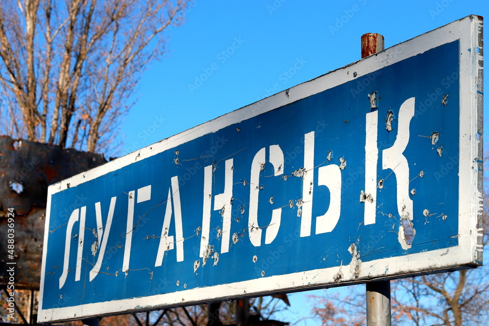 Ukraine Russia war Road sign in Ukrainian - Lugansk, pierced by bullets ...