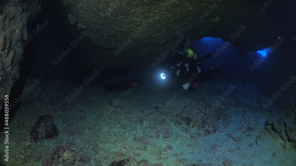 cave diving underwater scuba divers exploring caves and having fun ...