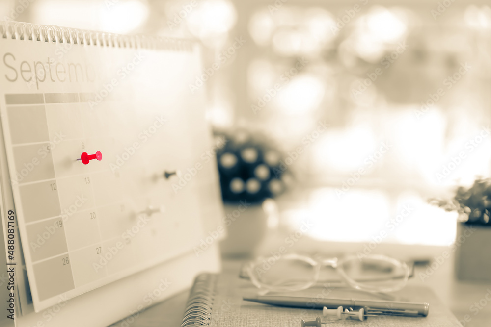 Calendar, Close-up red pin on blank desk calendar with office equipment ...