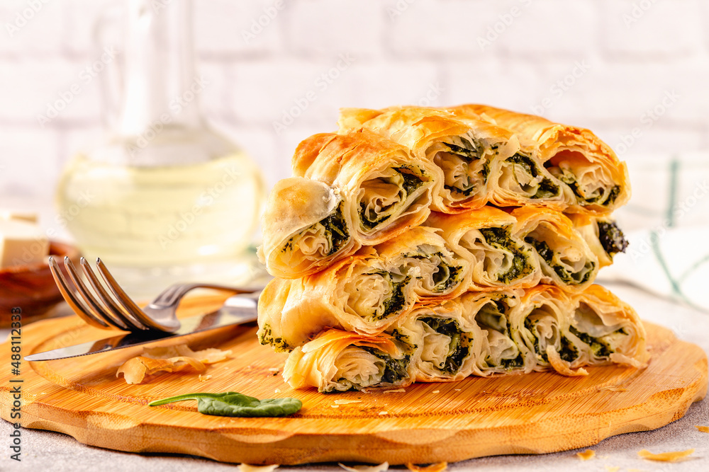 Spanakopita, greek phyllo pastry pie Stock Photo | Adobe Stock