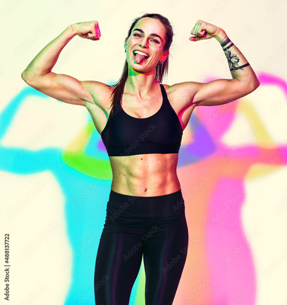 Strong woman after workout showing her muscles. Photo of woman with ...