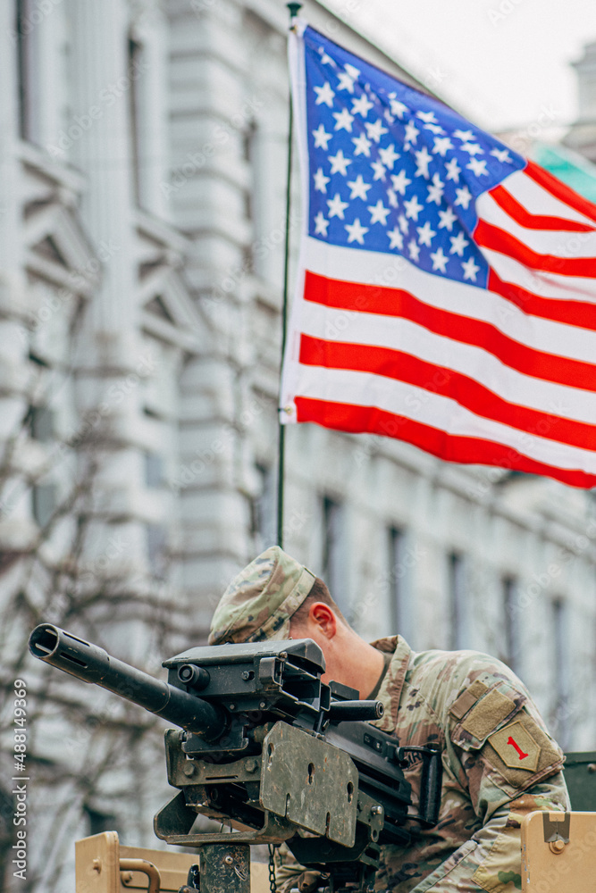 United States Marine Corps soldier on the top of a military vehicle ...