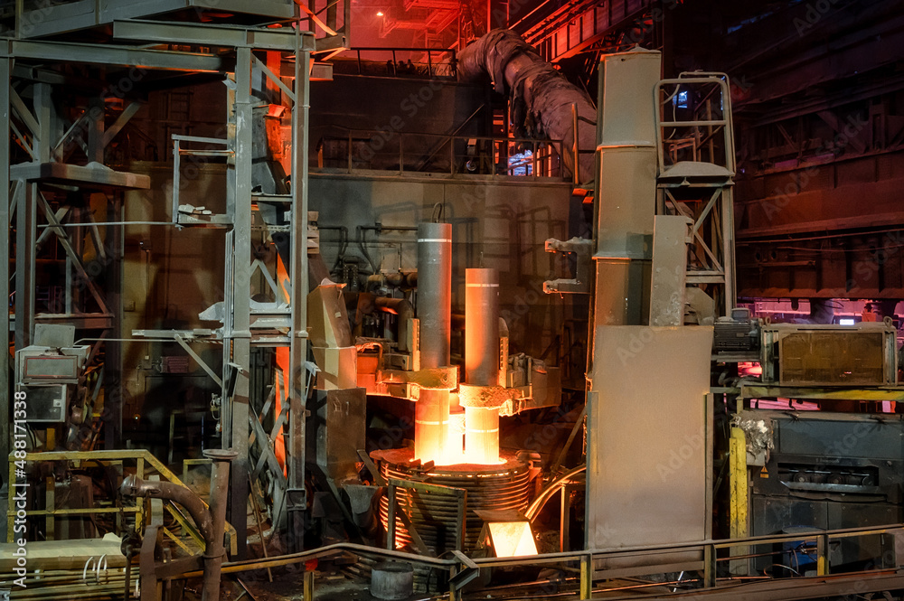 Electric arc steelmaking furnace, thick powerful red-hot graphite ...