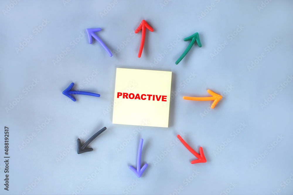 Proactive written on yellow sticky note with colorful arrow. Personal ...