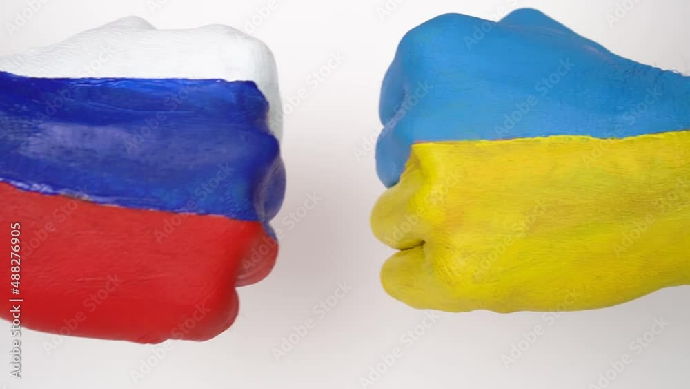 Flags of Ukraine and Russia Flag on hands punch to each other on white ...