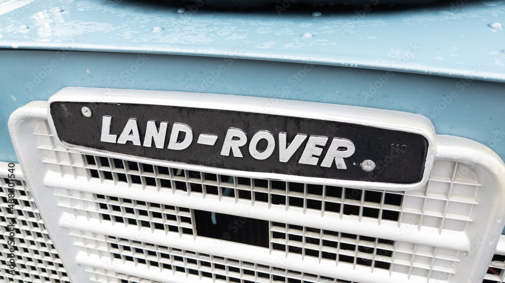 Land Rover defender logo brand and text sign front of vintage retro ...