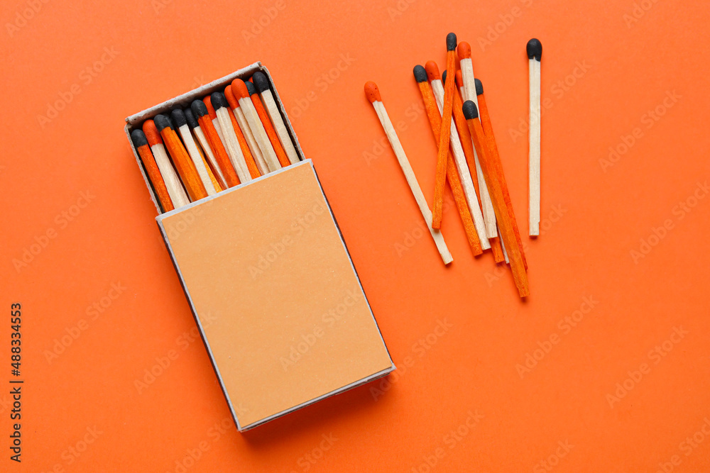 Box with different new matchsticks on orange background Stock Photo ...