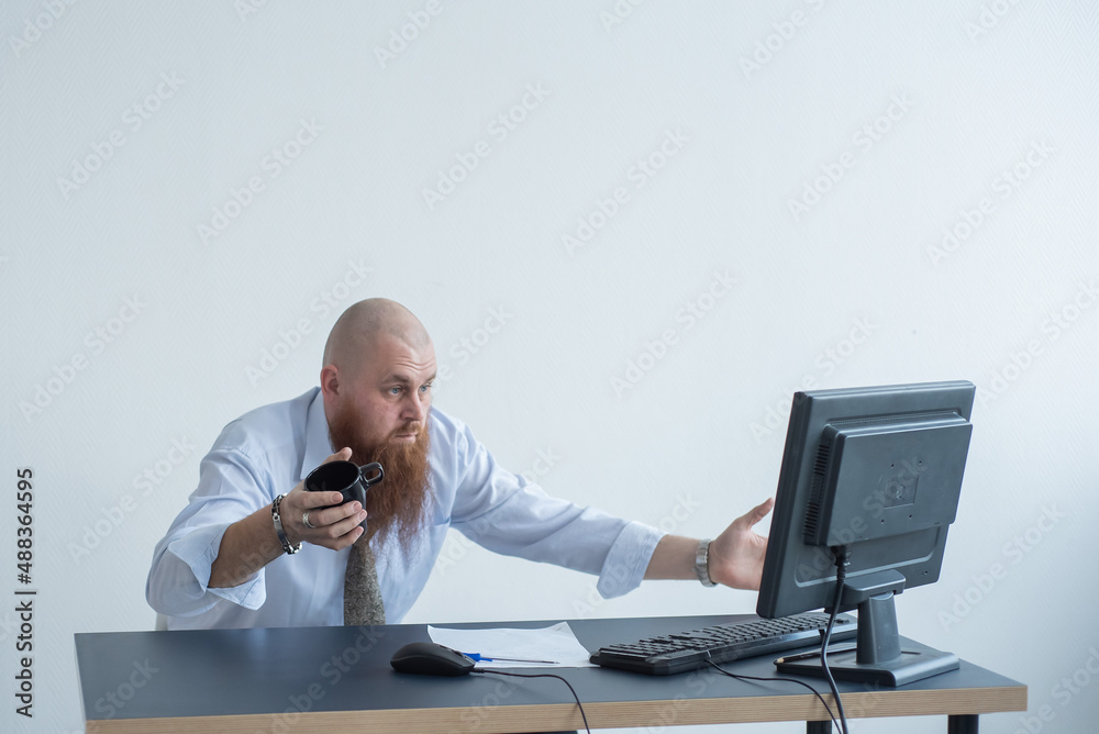 Problems for the office worker. A bald man in a white shirt sits at a ...