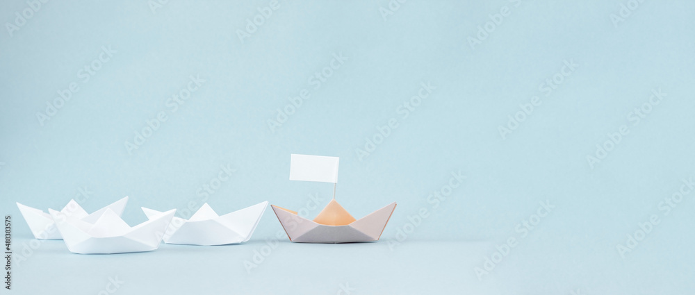Paper Boats. One leader ship leads others ships. Stock Photo | Adobe Stock