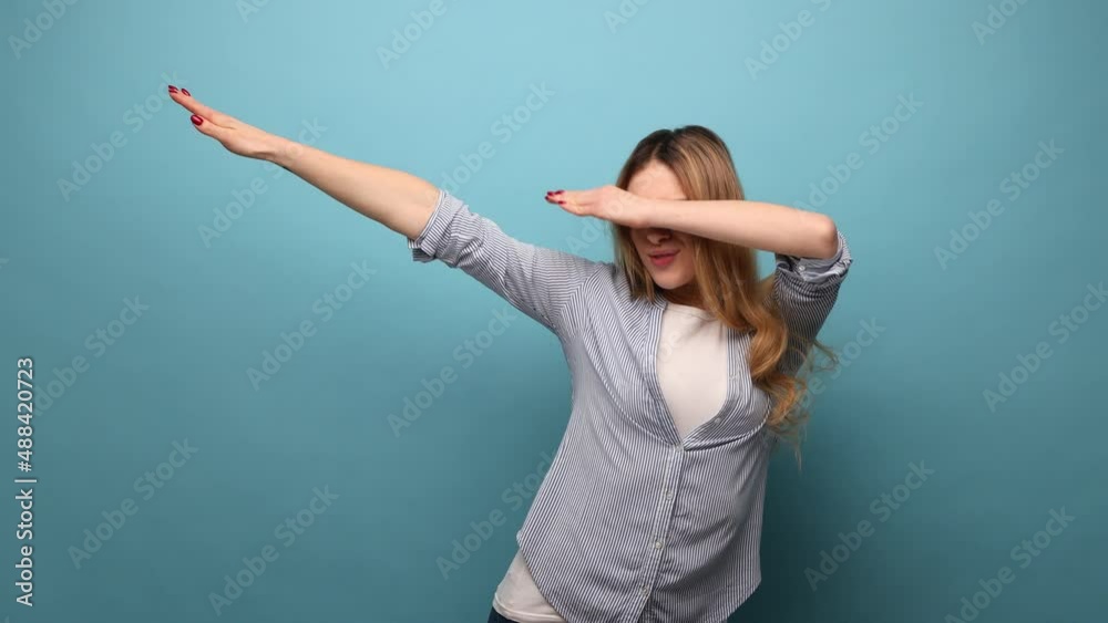 Video Stock Portrait of attractive woman showing dab dance pose, famous ...