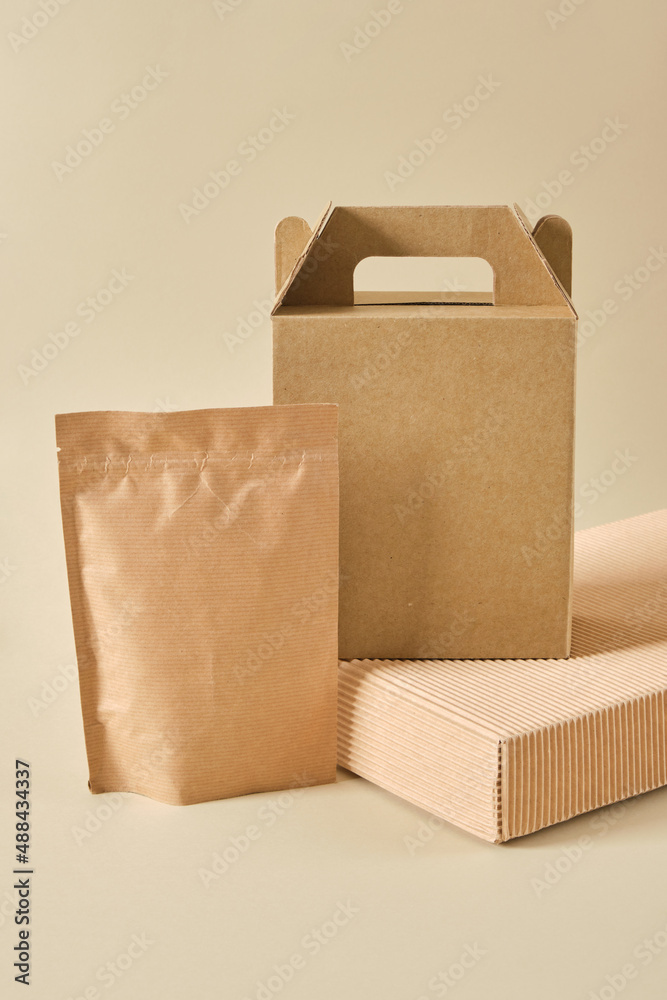 boxes and paper zip bags on a beige background, mock-up packaging for ...