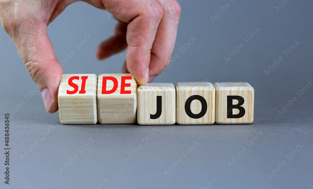 Side job symbol. Businessman turns wooden cubes and changes concept ...