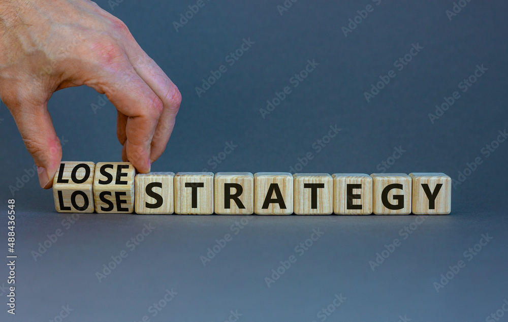 Lose-lose strategy symbol. Businessman turns wooden cubes with words ...