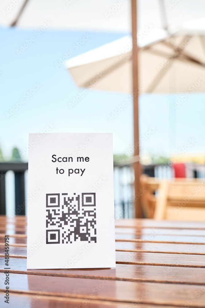 QR code for contactless, cashless payment, placed on the table of a ...