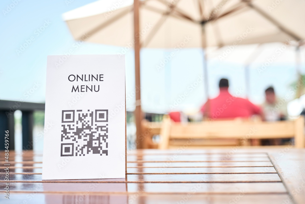 Table with a QR code to access a restaurant digital menu Stock Photo ...