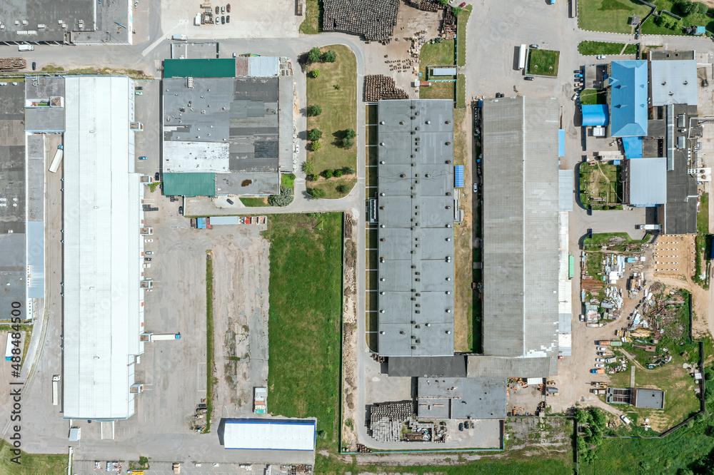 big distribution center in industrial area. top aerial view on roof of ...