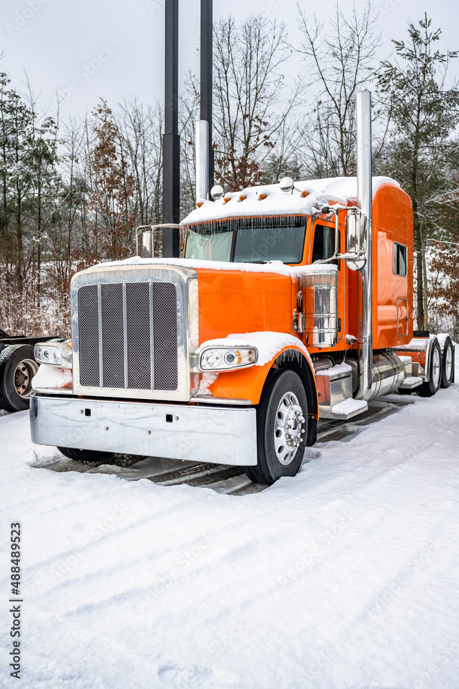 Classic orange big rig semi truck tractor with chrome accessories ...