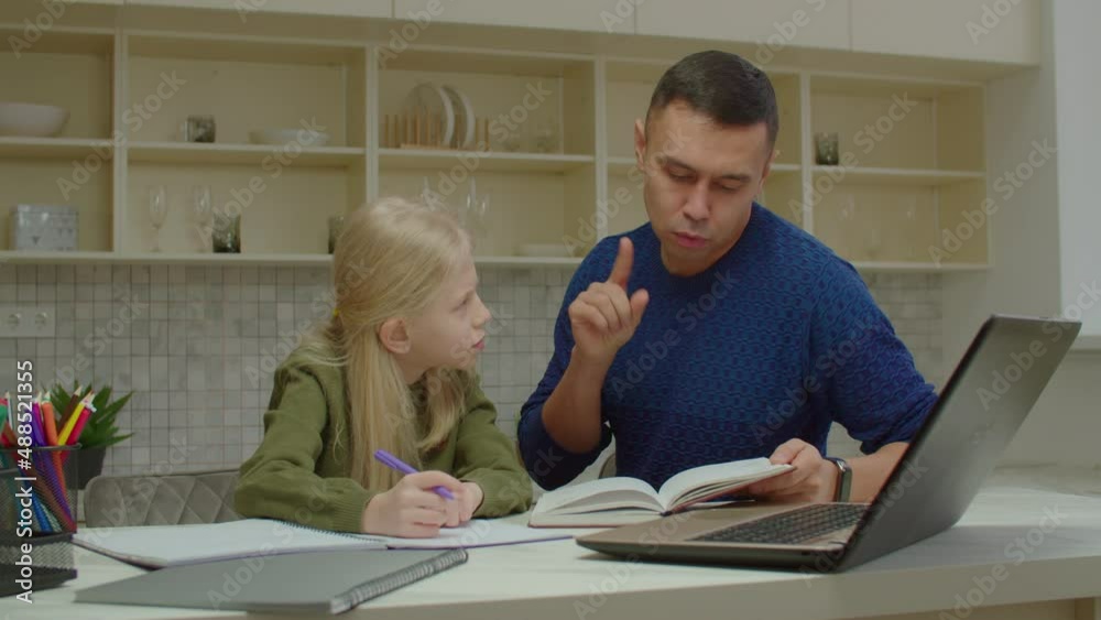 Affectionate handsome deaf father t helping cute elementary age ...