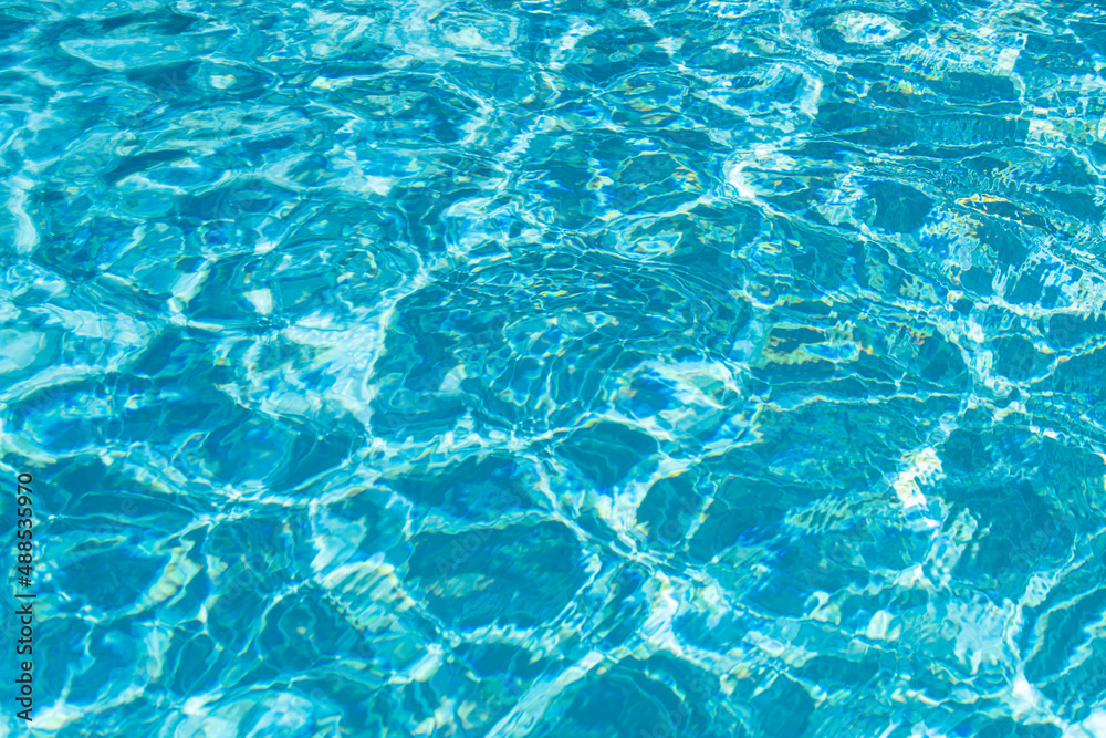 Abstract ripple wave and clear turquoise water surface in swimming pool ...