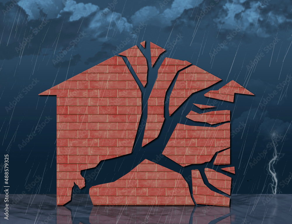 Storm damage to a home is the theme of this image. A brick home is ...