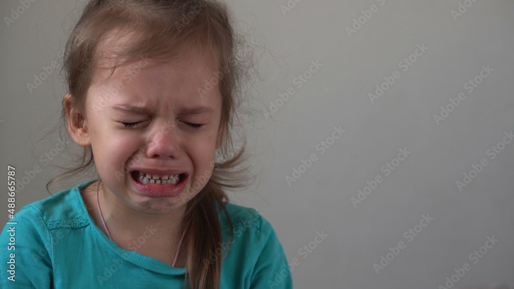 Portrait little girl sad upset child burst into tears cries sob looking ...