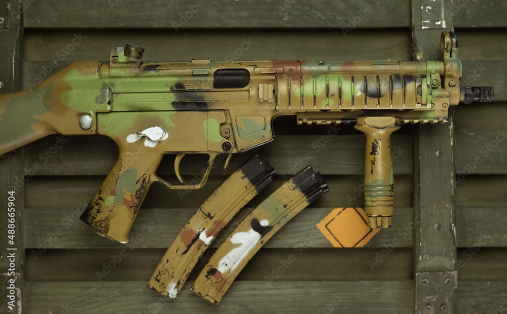 mp5 automatic rifle next to ammunition box and other military ...
