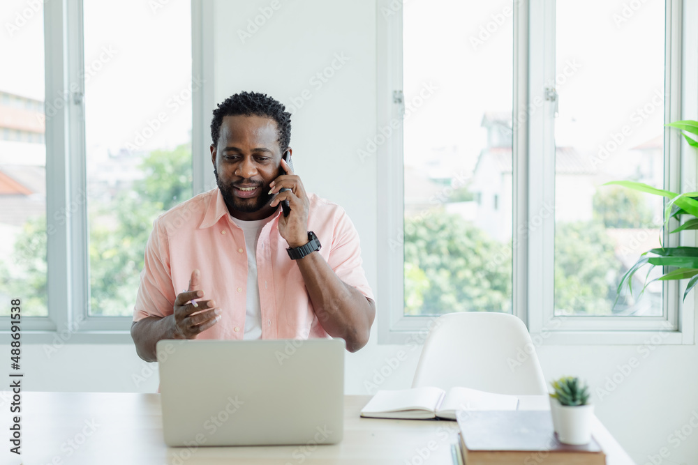 Black male african american receiving talking mobile phone and working ...