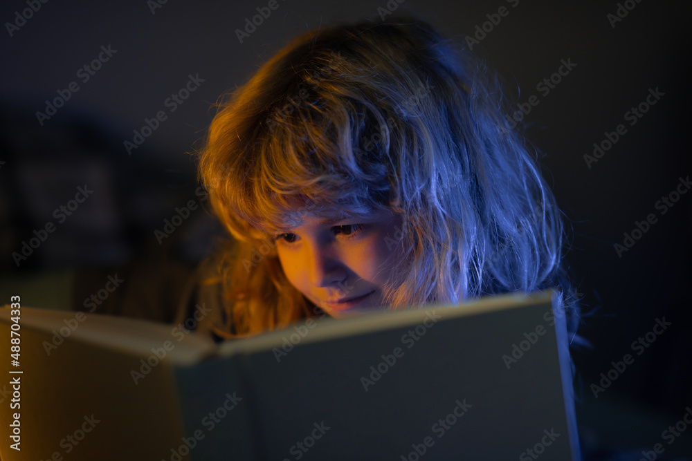 Child read fairy tale from book. Little boy in living room watching ...