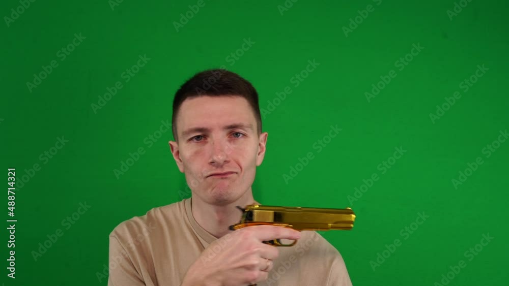 The man points the gun in his hand to the side, look there, shooting on ...