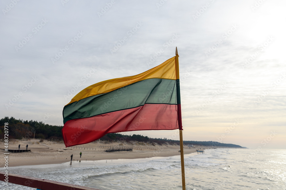 Lithuanian flag in wind at coast of Lithuania. Stock Photo | Adobe Stock
